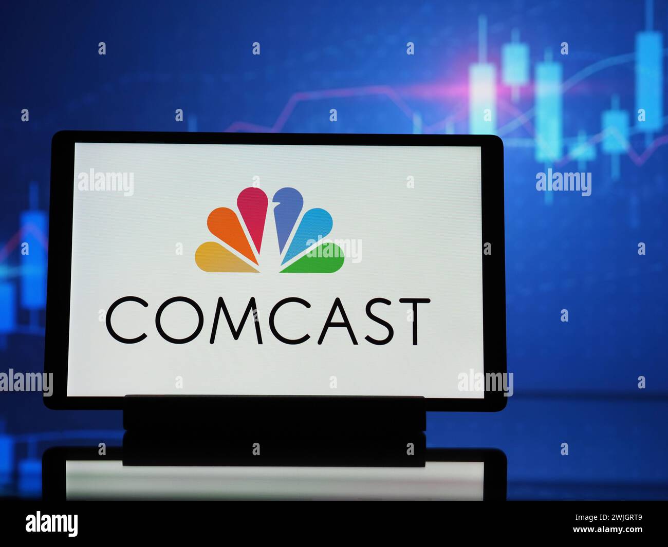 In this photo illustration, Comcast Corporation logo seen displayed on ...