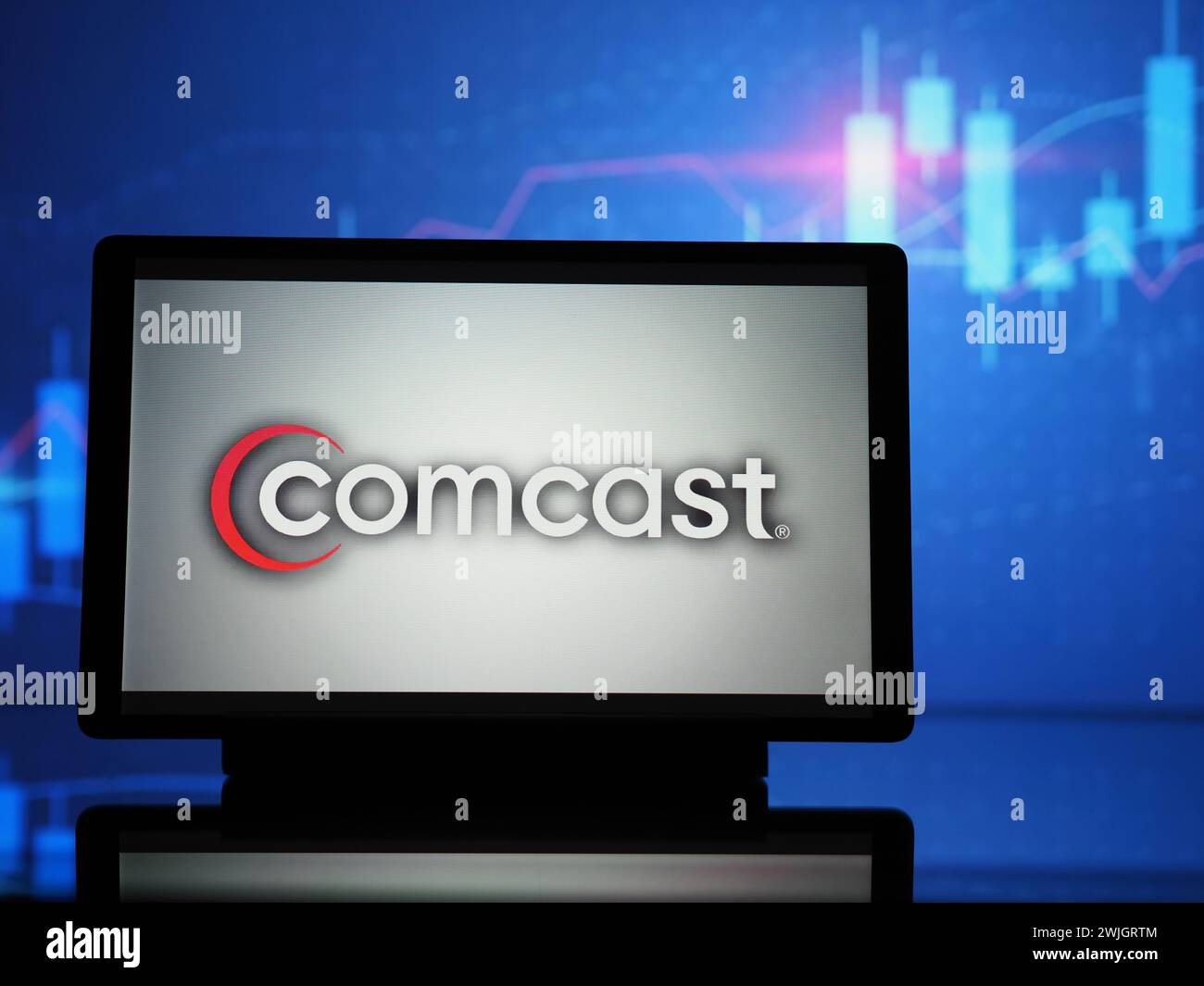 In this photo illustration, Comcast Corporation logo seen displayed on ...