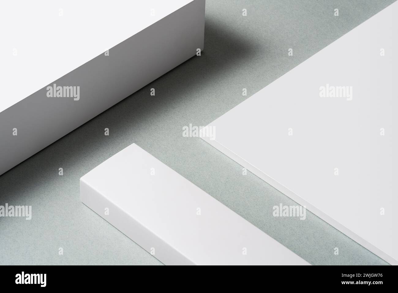 White layered platform, pedestal, boxes on gray background. Abstract ...
