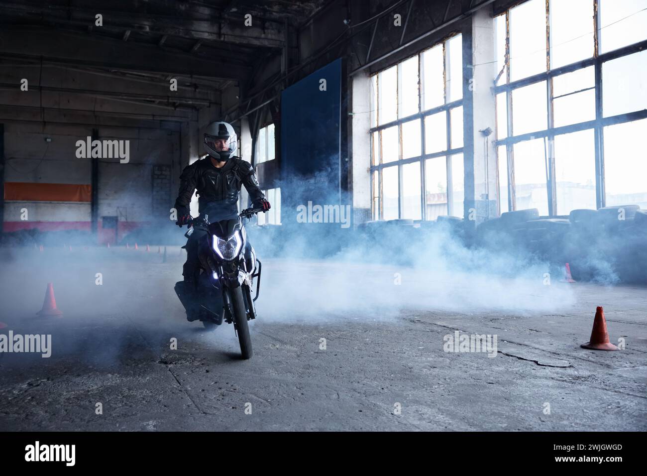 Motor rider making difficult and dangerous stunt on his motorbike Stock ...