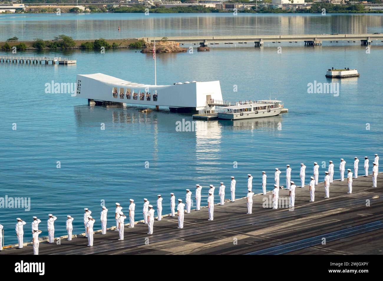 Pearl Harbor, Hawaii, USA. 13th Feb, 2024. Sailors render honors to the ...