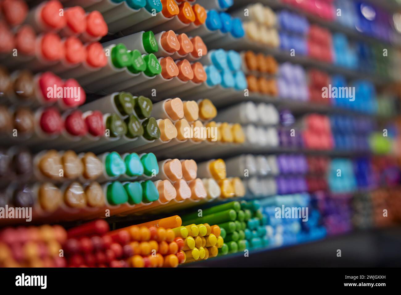 Colorful markers of assorted colors on stationery rack shelves Stock ...