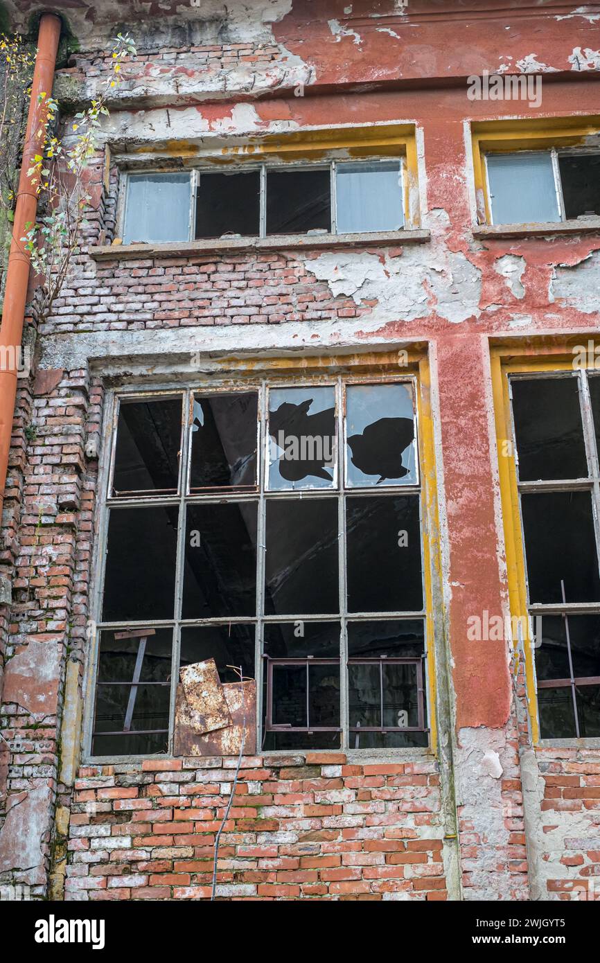 old decaying building with broken windows Stock Photo - Alamy