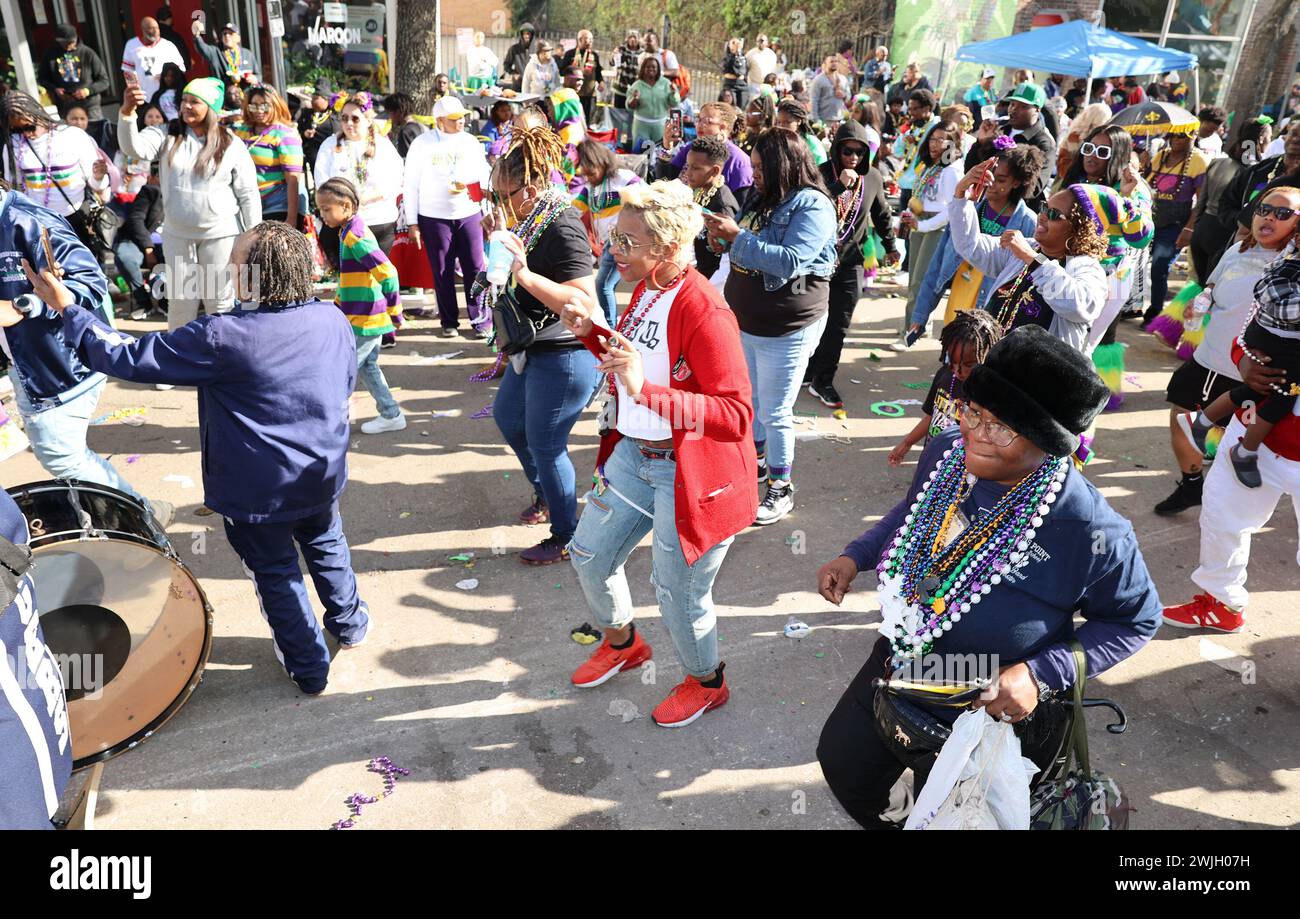 New Orleans, USA. 13th Feb, 2024. Event goers dance in the street ...