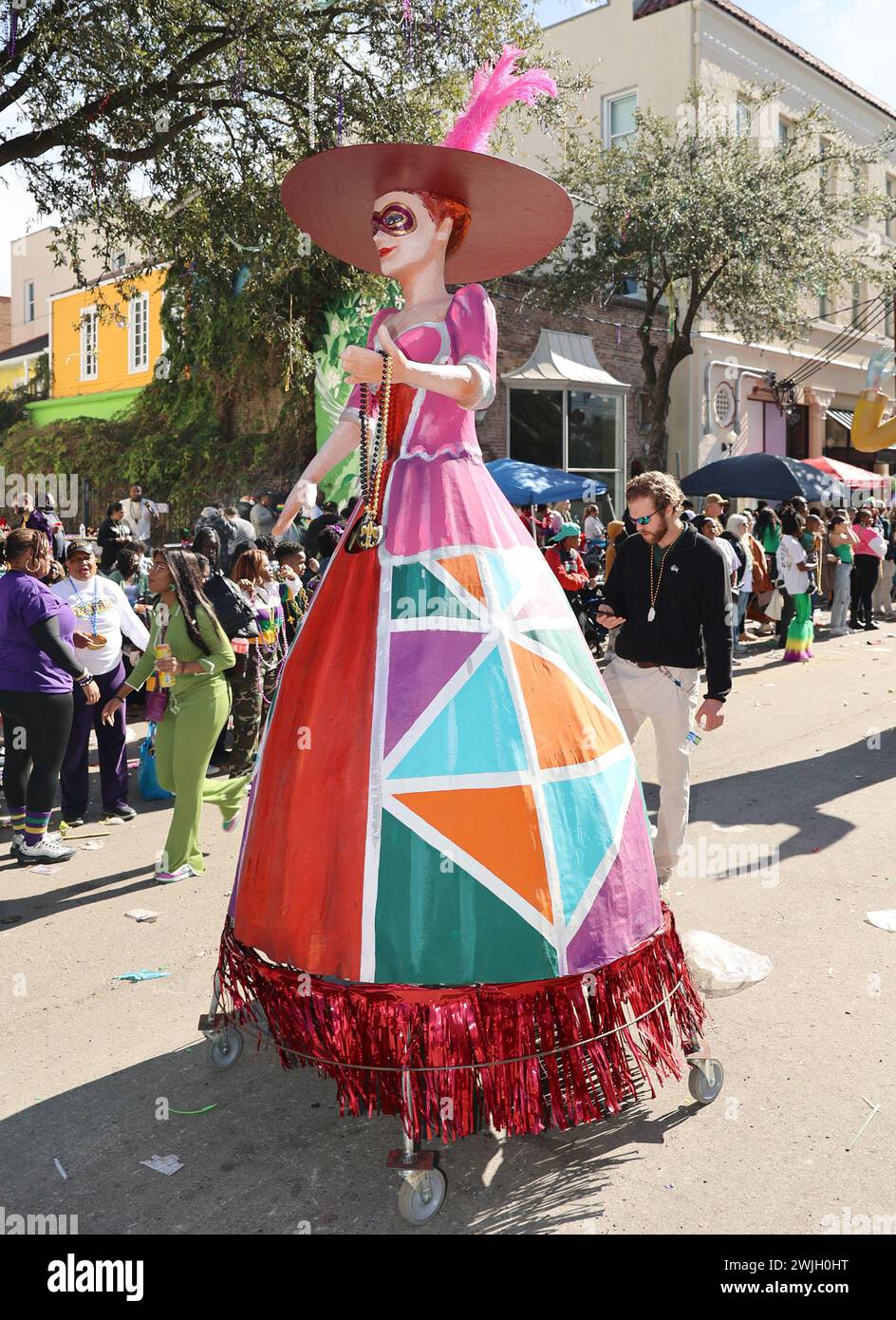 A oversized woman figurine rolls through during the Rex Parade on St ...