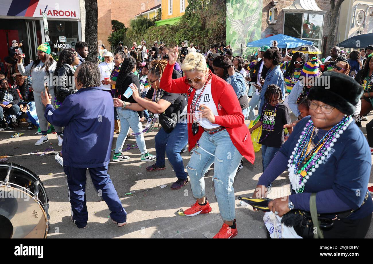 New Orleans, USA. 13th Feb, 2024. Event goers dance in the street ...