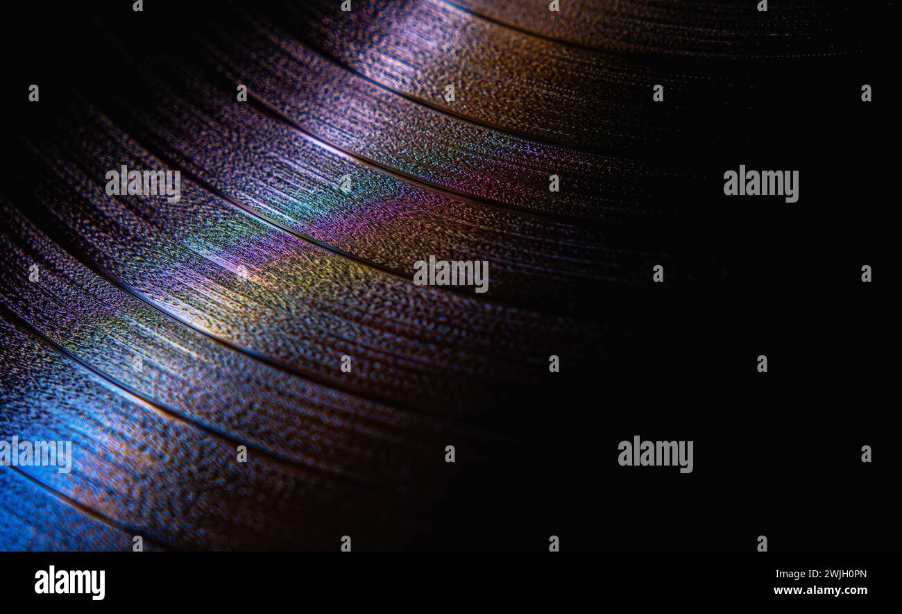 Vinyl record rotating in a macro shot with a rainbow Stock Photo - Alamy