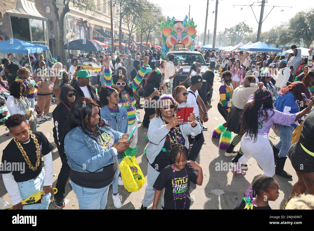 New Orleans, USA. 13th Feb, 2024. Event goers dance in the street ...