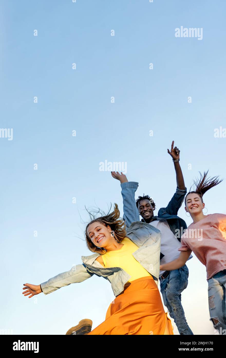 Group of young multiracial friends enjoying freedom together - Happy ...