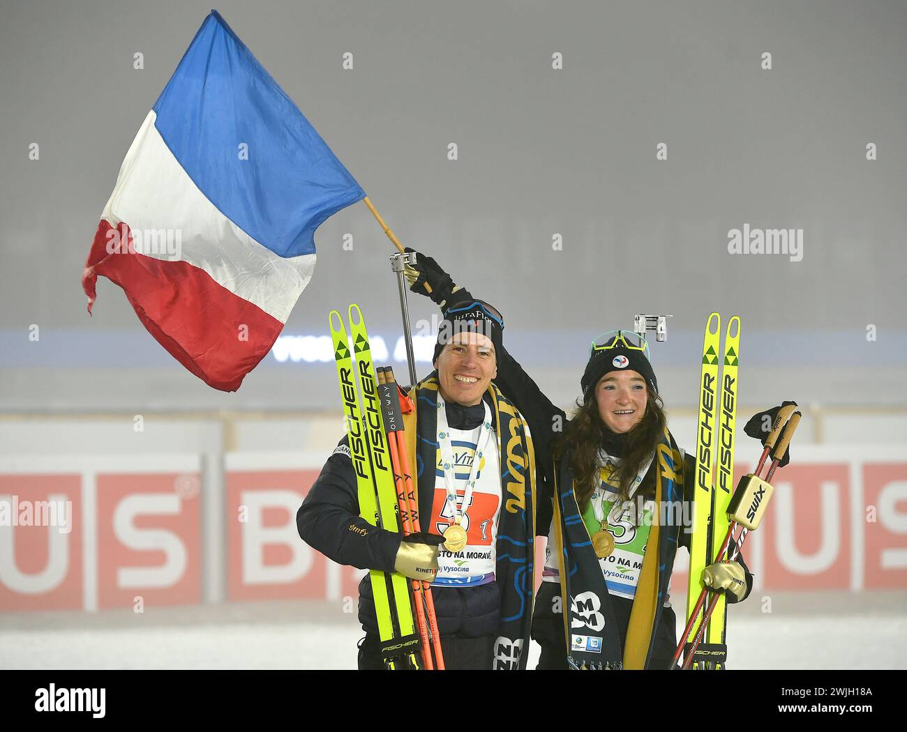 Quentin Fillon Maillet, left, and Lou Jeanmonnot (FRA) pose with their ...