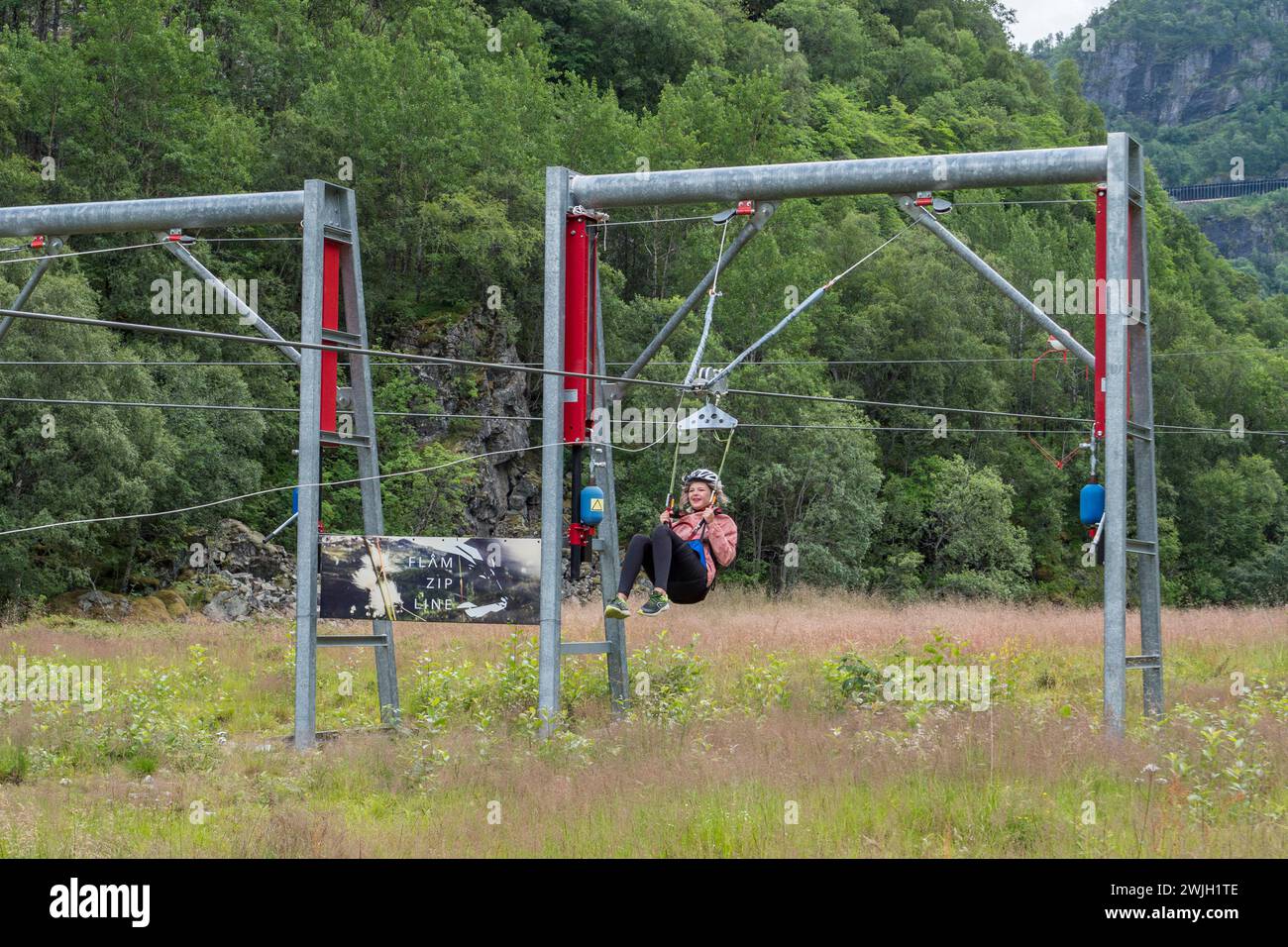 Rider finishes the Flåm Zipline in the Myrdal/Flåm valley, Norway Stock ...