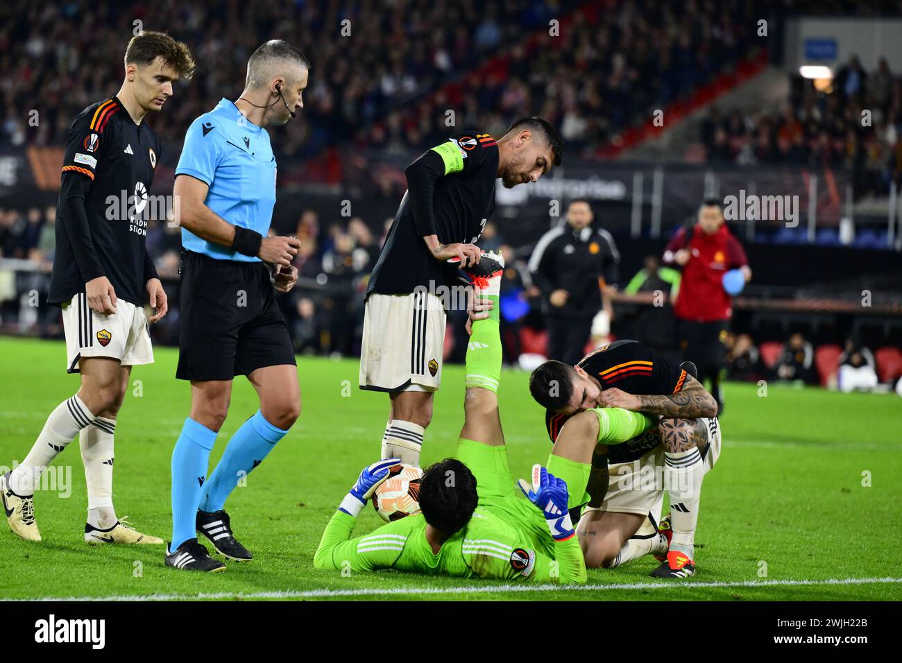 ROTTERDAM - AS Roma goalkeeper Mile Svilar lies injured on the ground ...