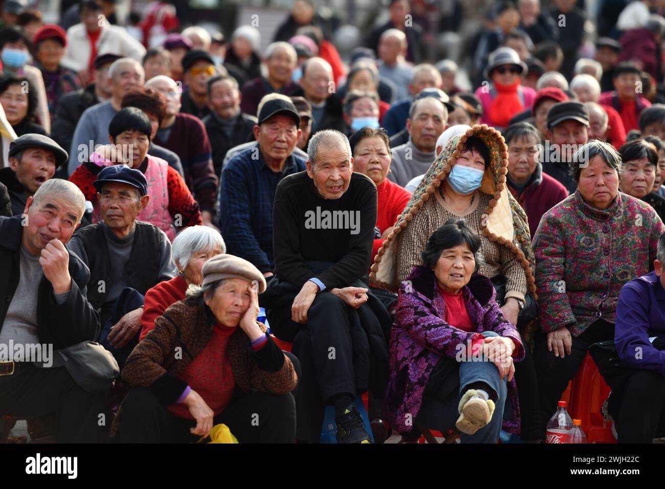 Fuyang, China. 14th Feb, 2024. People watch the traditional Chinese ...