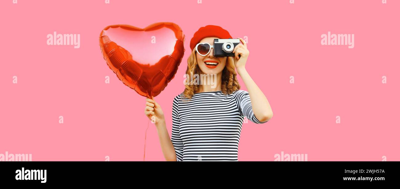 Summer portrait of happy smiling young woman with film camera and red ...