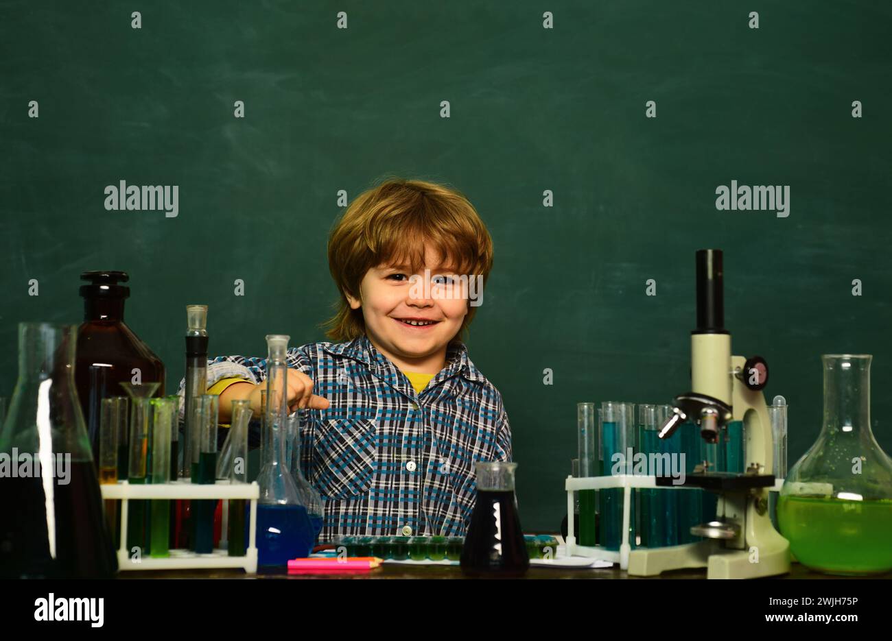 Chemistry lesson. My chemistry experiment. Happy smiling pupil drawing ...