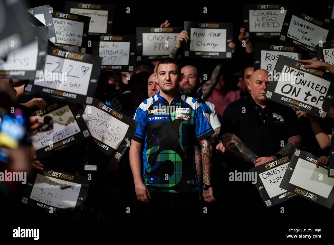 Nathan Aspinall walks out to play Luke Humphries (not pictured) during ...