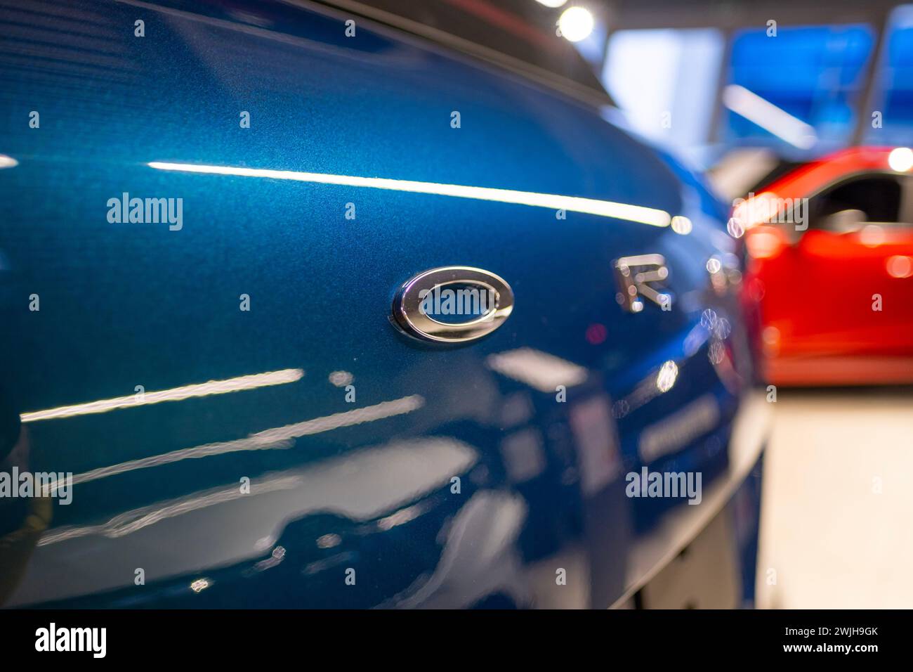 Logo on cap close-up, blue electric car GWM ORA 03, automobile details ...