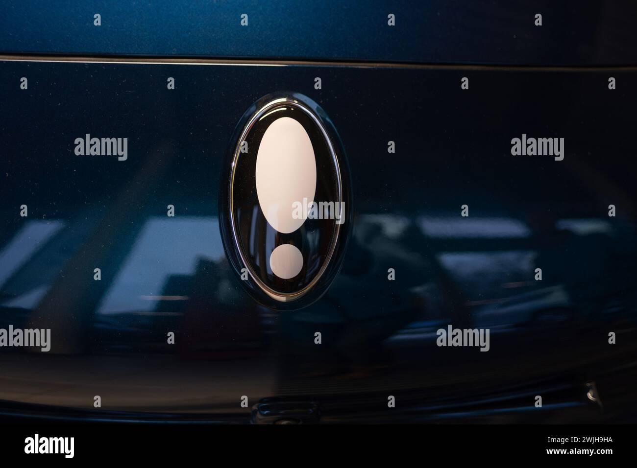 Logo on cap close-up, blue electric car GWM ORA 03, automobile details ...