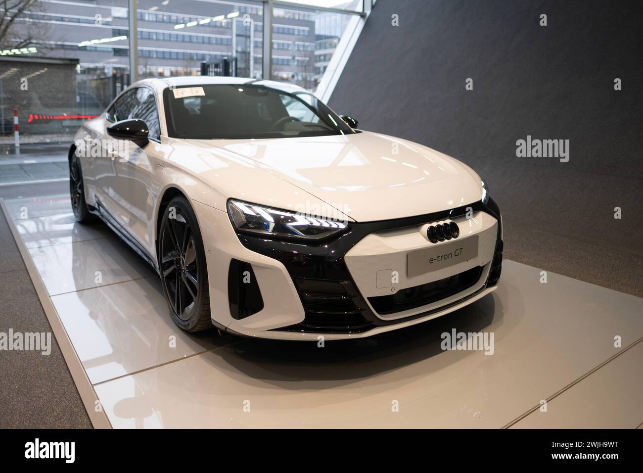 white new Luxury Electric Car Audi e-tron GT, limousine, four-door coupe in showroom, Automotive ...