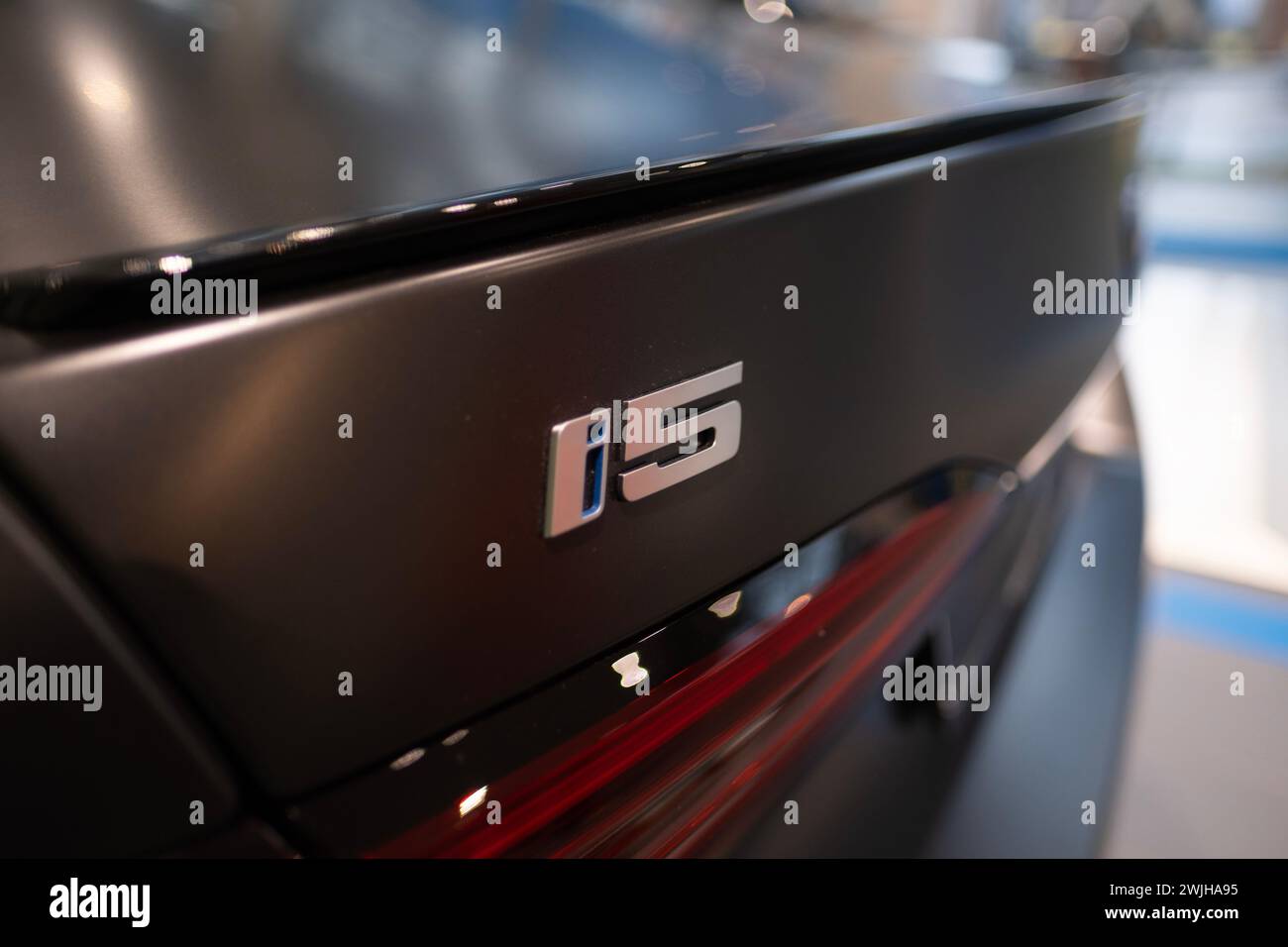 part of black BMW i5 eDrive40 all-electric sedan, rear view Electric ...