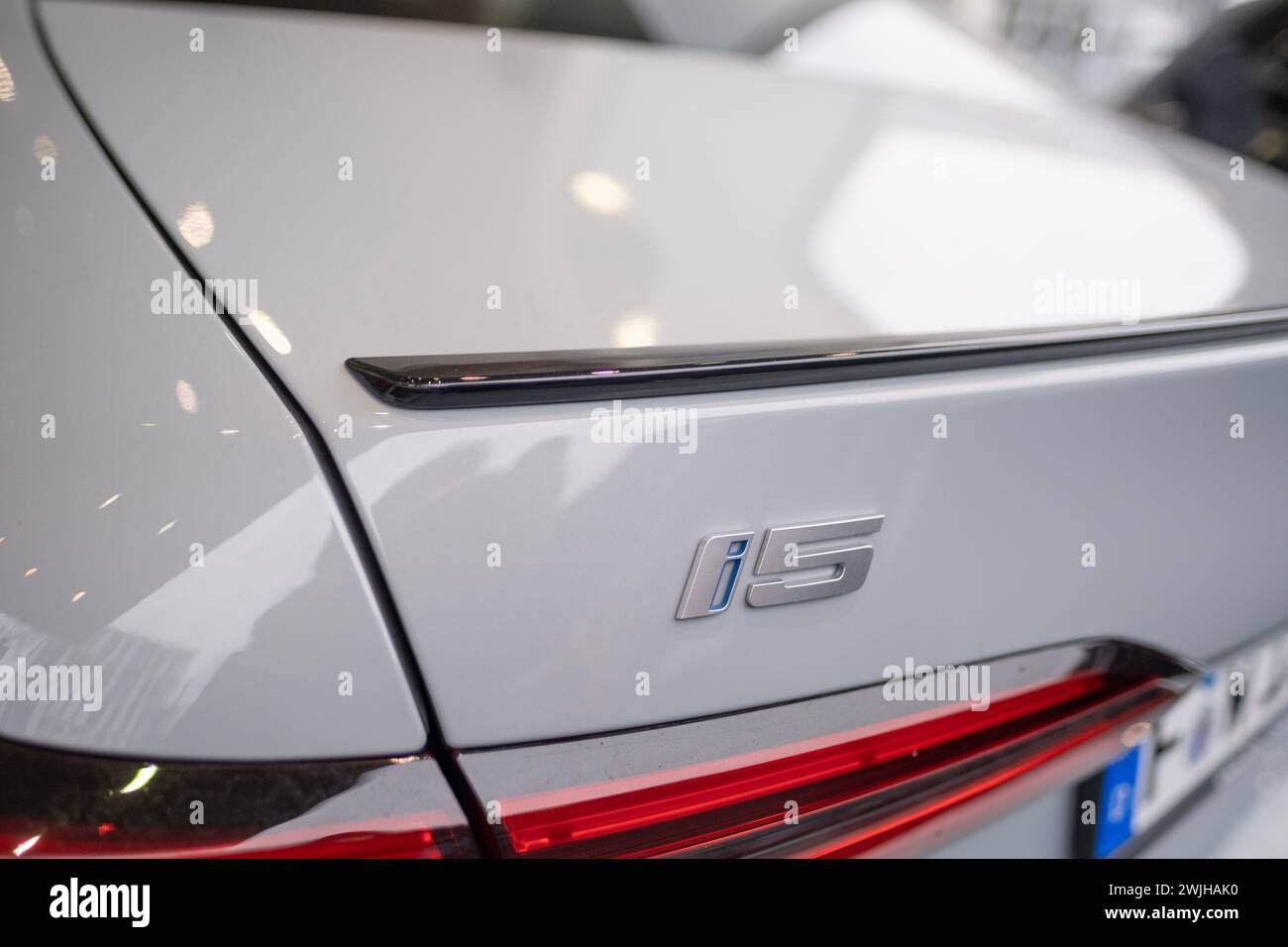 part of white BMW i5 eDrive40 all-electric sedan, rear view Electric ...