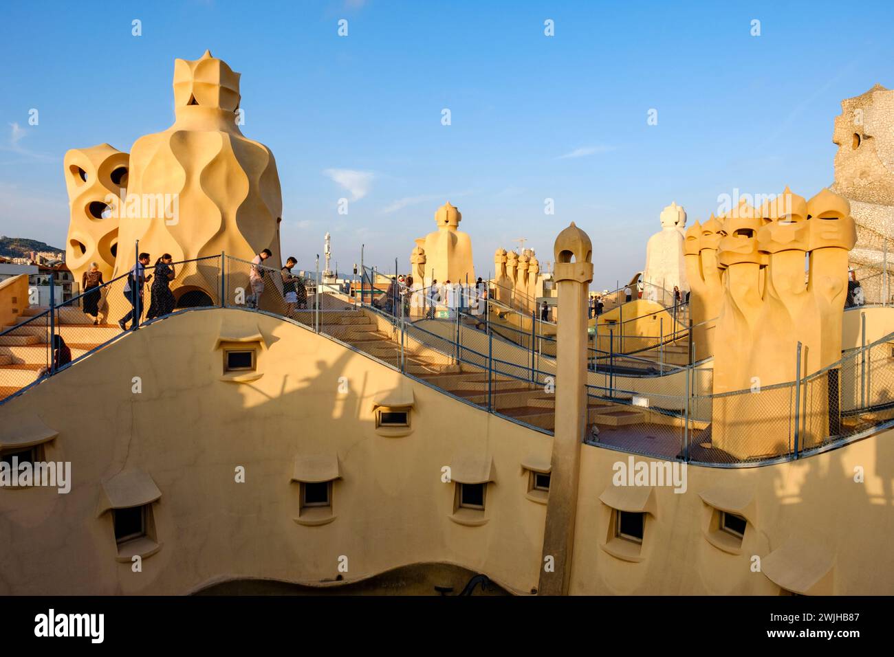 Roof of Casa Milà, La Pedrera, tourists on rooftop, terrace chimneys ...