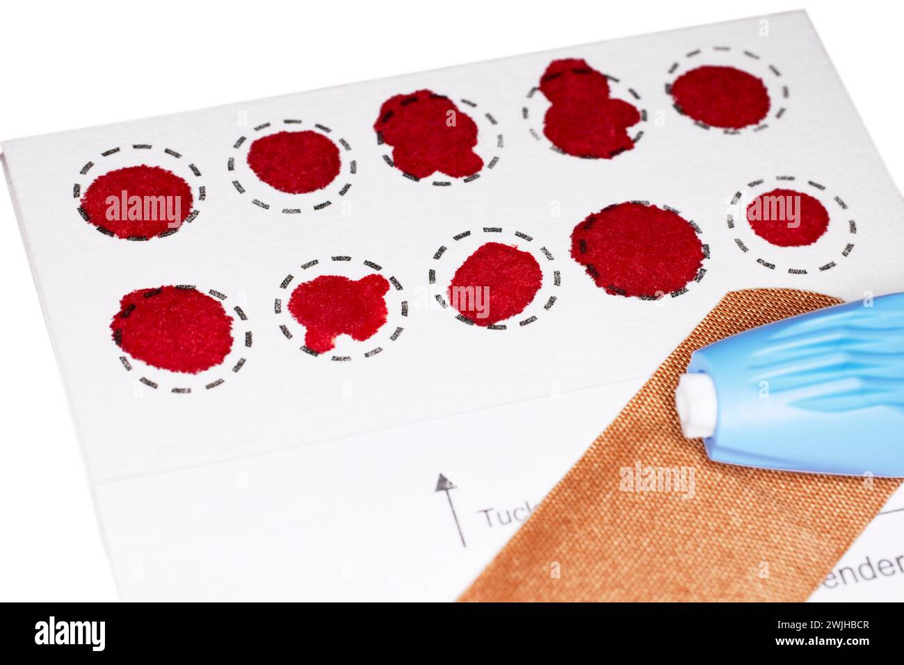 A Completed Blood Spot test card with droplets of blood for hormone ...