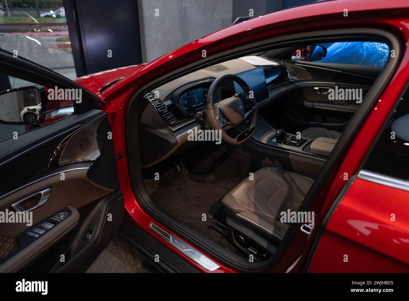 steering wheel, Interior, cockpit of red BYD Han EV 3.95, side view ...