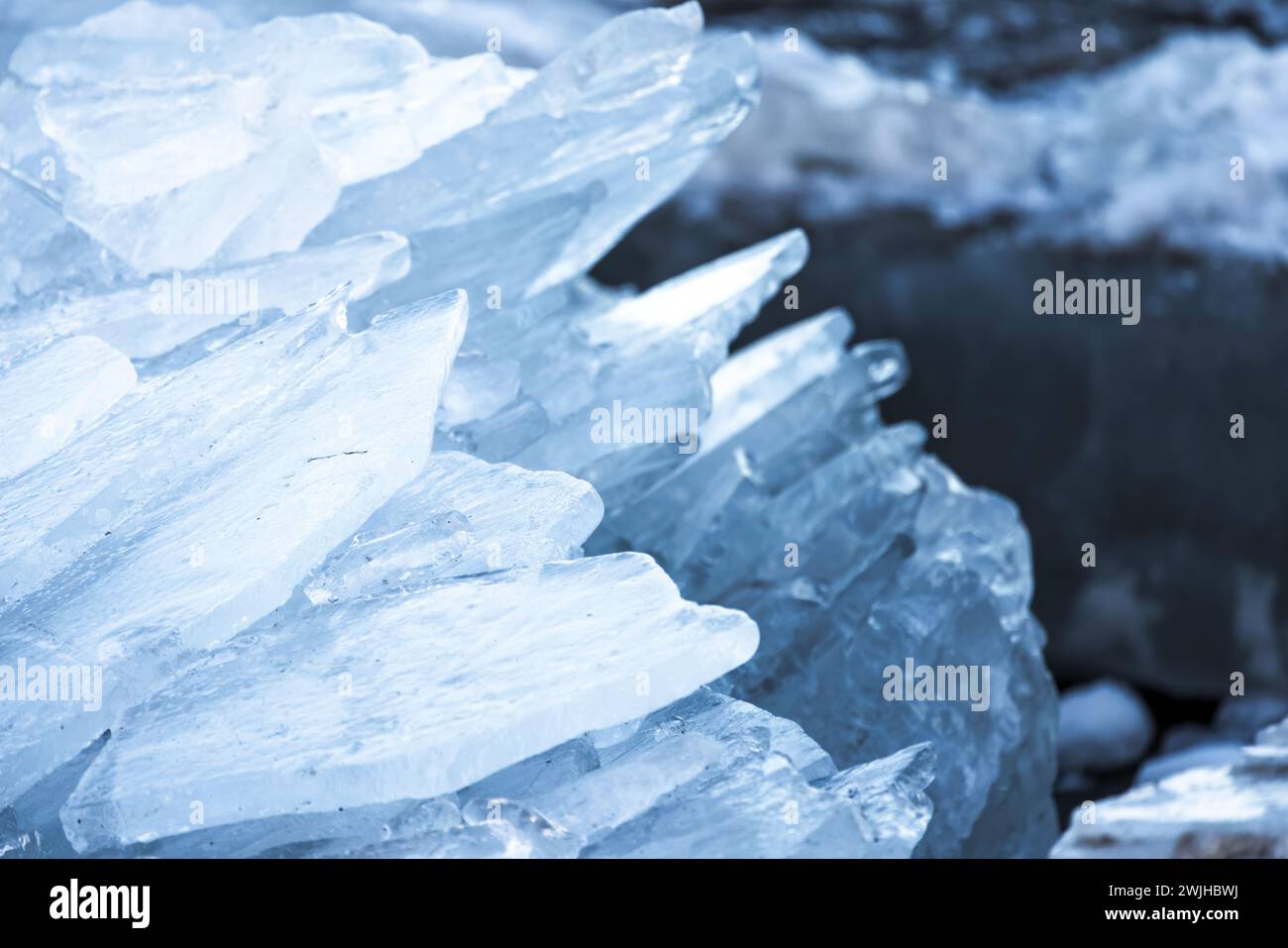 Ice shards macro photo with selective soft focus and blurred blue ...