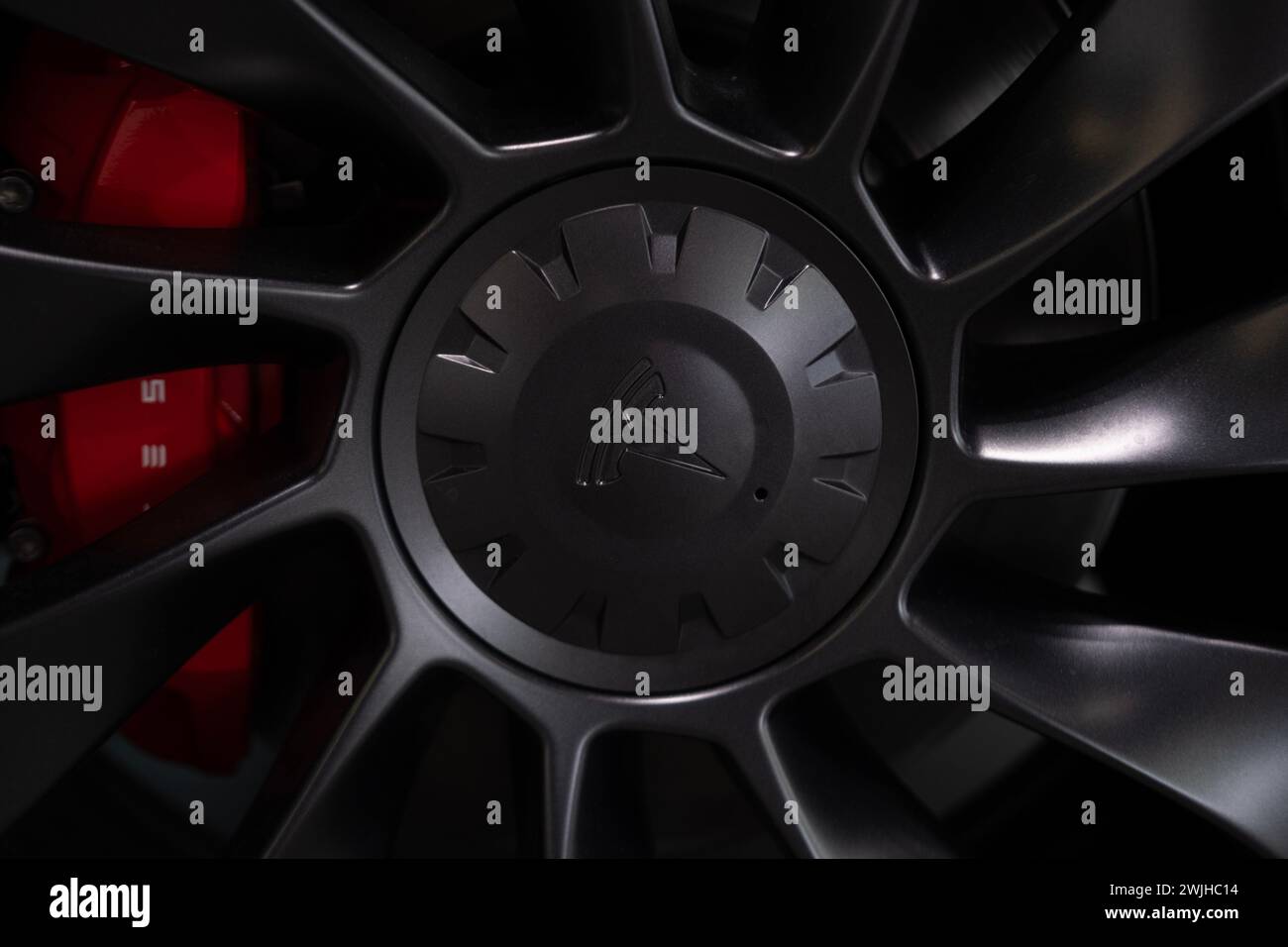 Tesla car model Y wheel, in cherry red color in Studio, electric ...