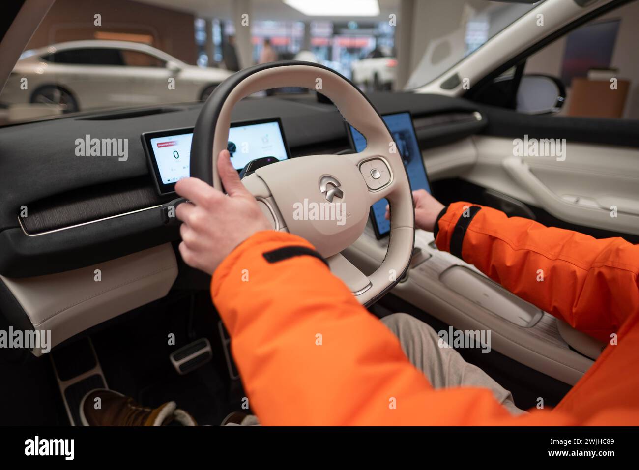 close-up male hands on steering wheel, NIO EL7 Interior, cockpit modern ...