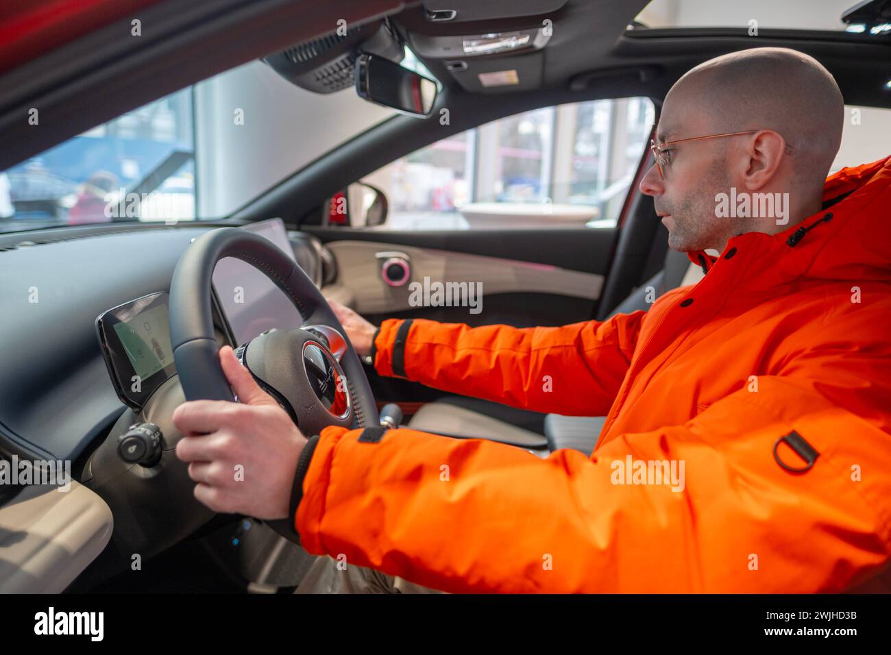 male hands on steering wheel, Interior, cockpit of BYD ATTO 3 Car in ...