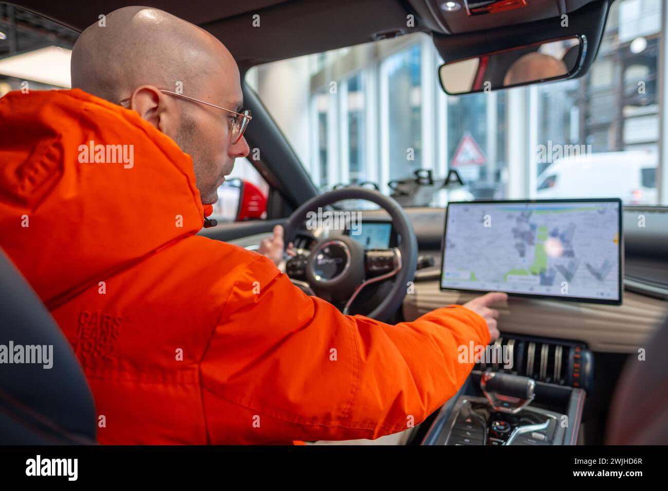 man in car driving BYD ATTO 3 Car Electric Car, male hand on button ...