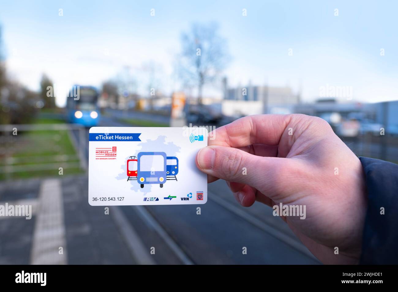 male hand holds electronic eTicket Germany, plastic monthly travel card ...