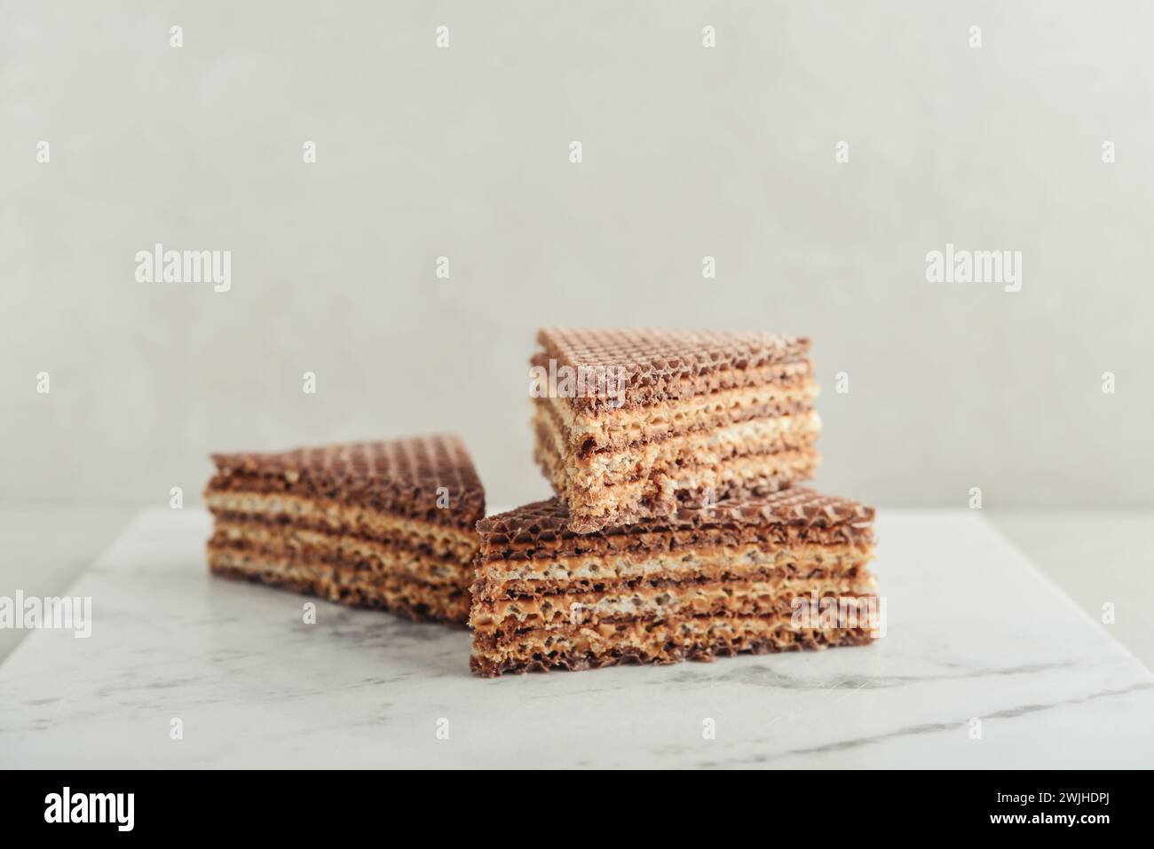 Waffle cake made of crispy waffle cakes with boiled condensed milk on a ...