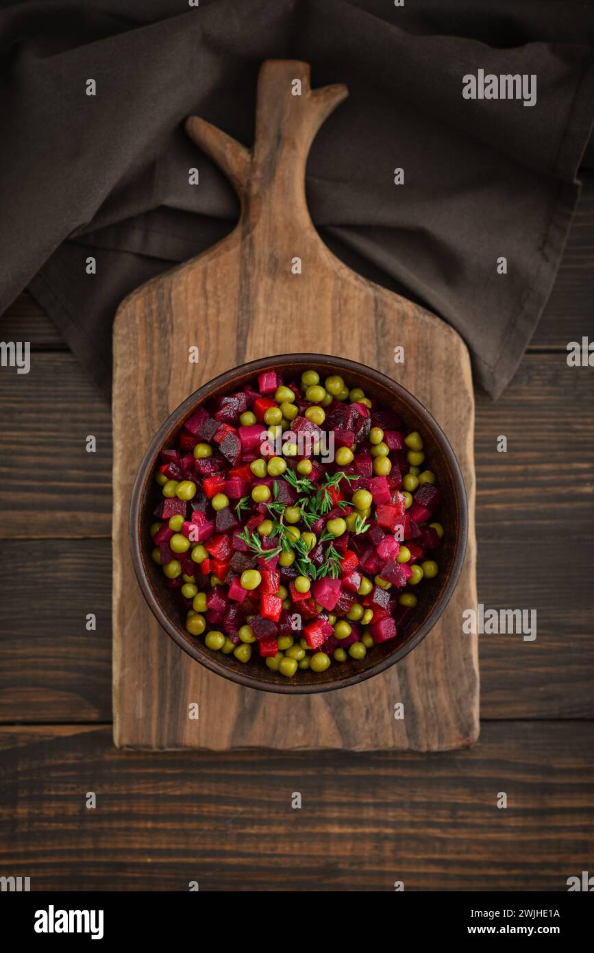 Vinegret - traditional Russian vegetable salad in bowl on wooden ...