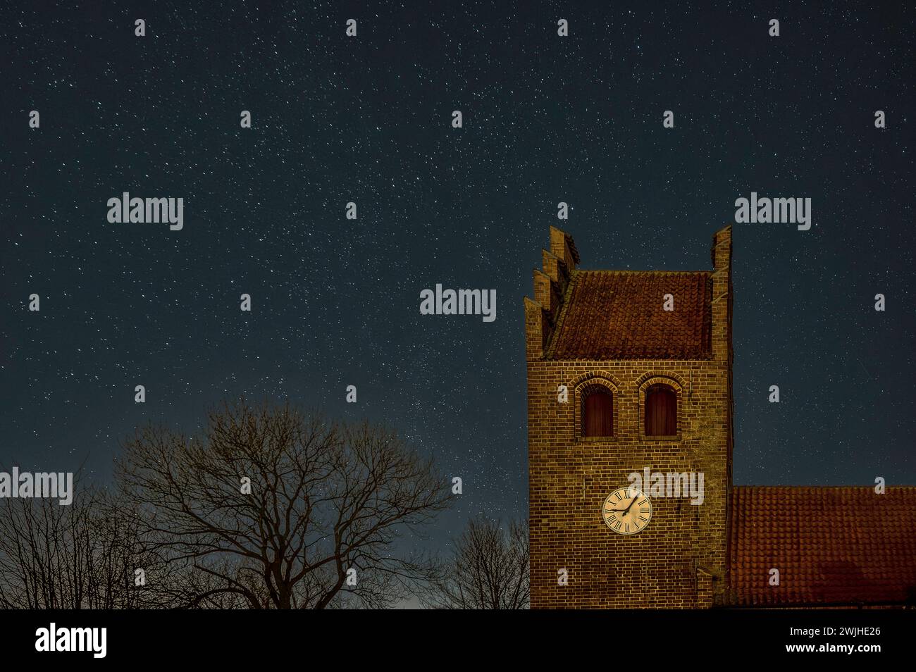 church clocktower at night and stars in the sky, Oppe Sundby church ...