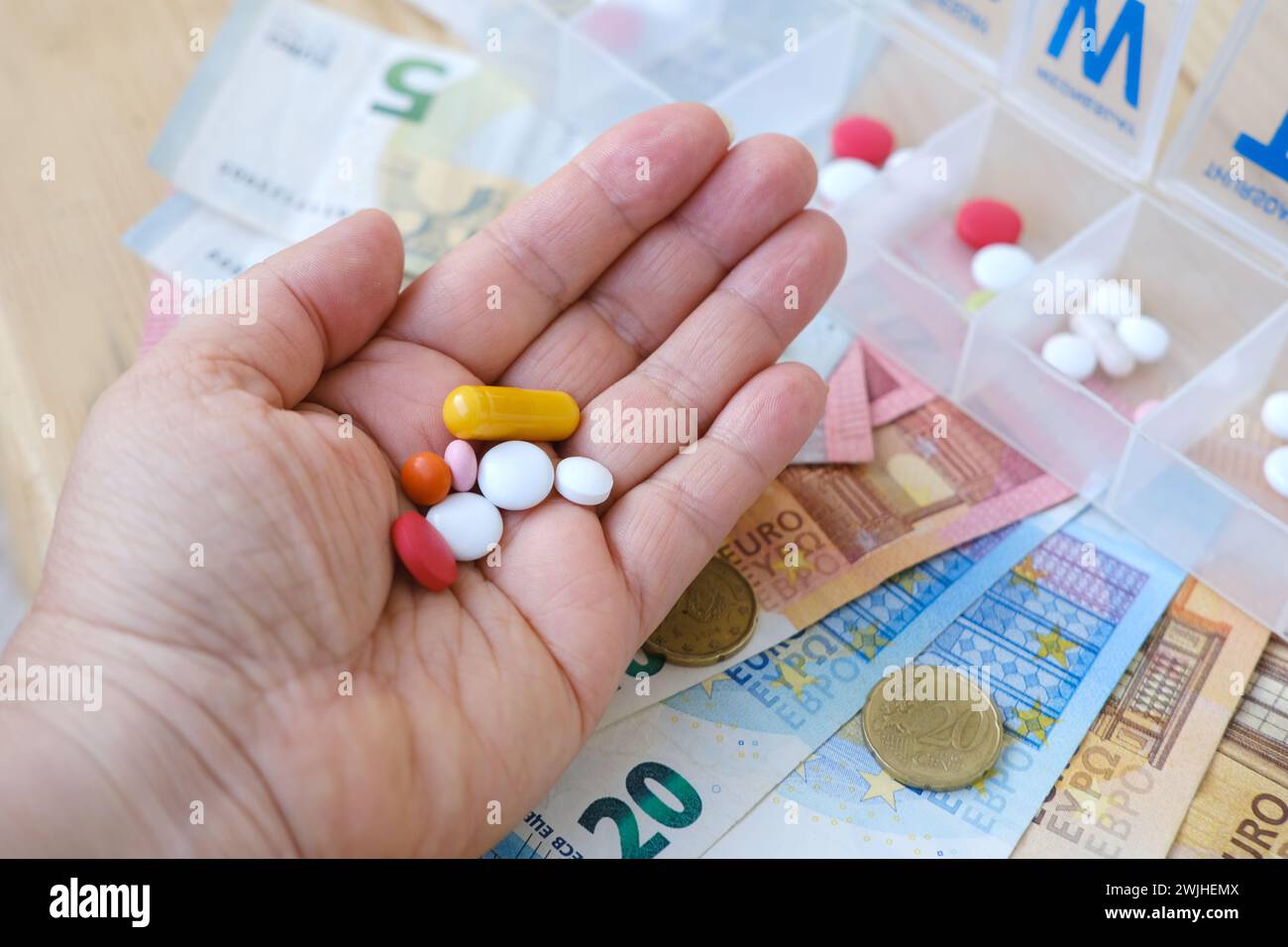 Pill organizer money hi-res stock photography and images - Alamy
