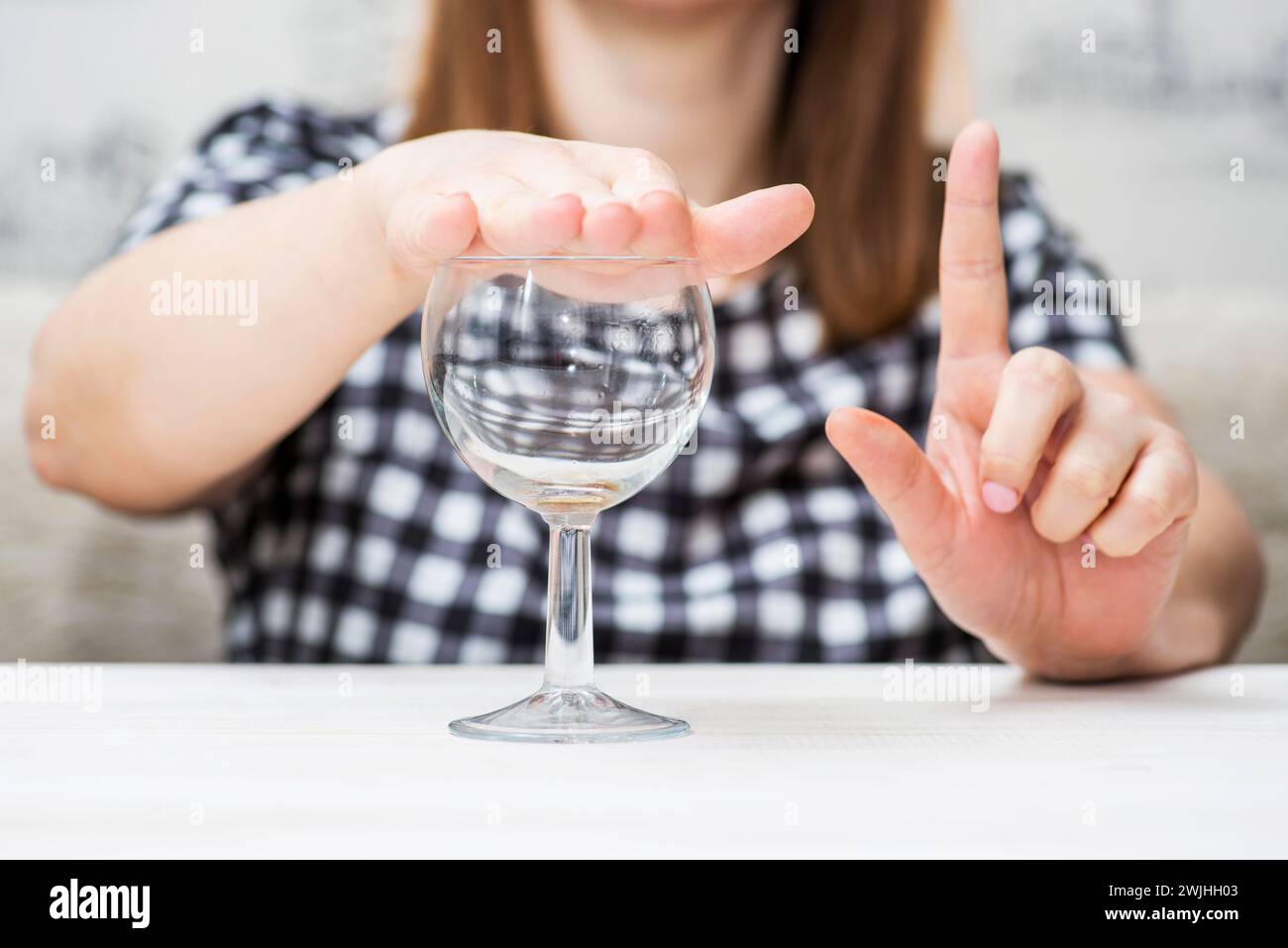 Woman Refusing Glass of Water Signifying No Drinking Stock Photo - Alamy