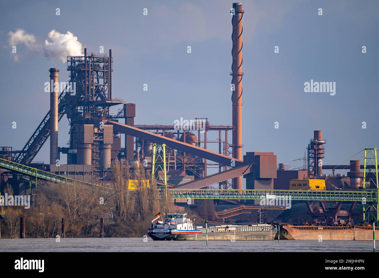 The Rhine near Duisburg, cargo ships, backdrop of the ThyssenKrupp ...