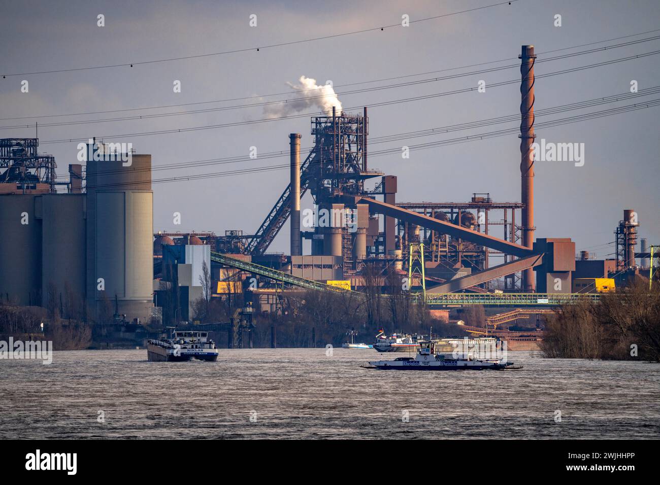 The Rhine near Duisburg, cargo ships, backdrop of the ThyssenKrupp ...