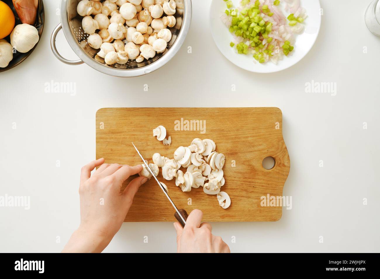 Female hands cutting fresh champignon hi-res stock photography and ...