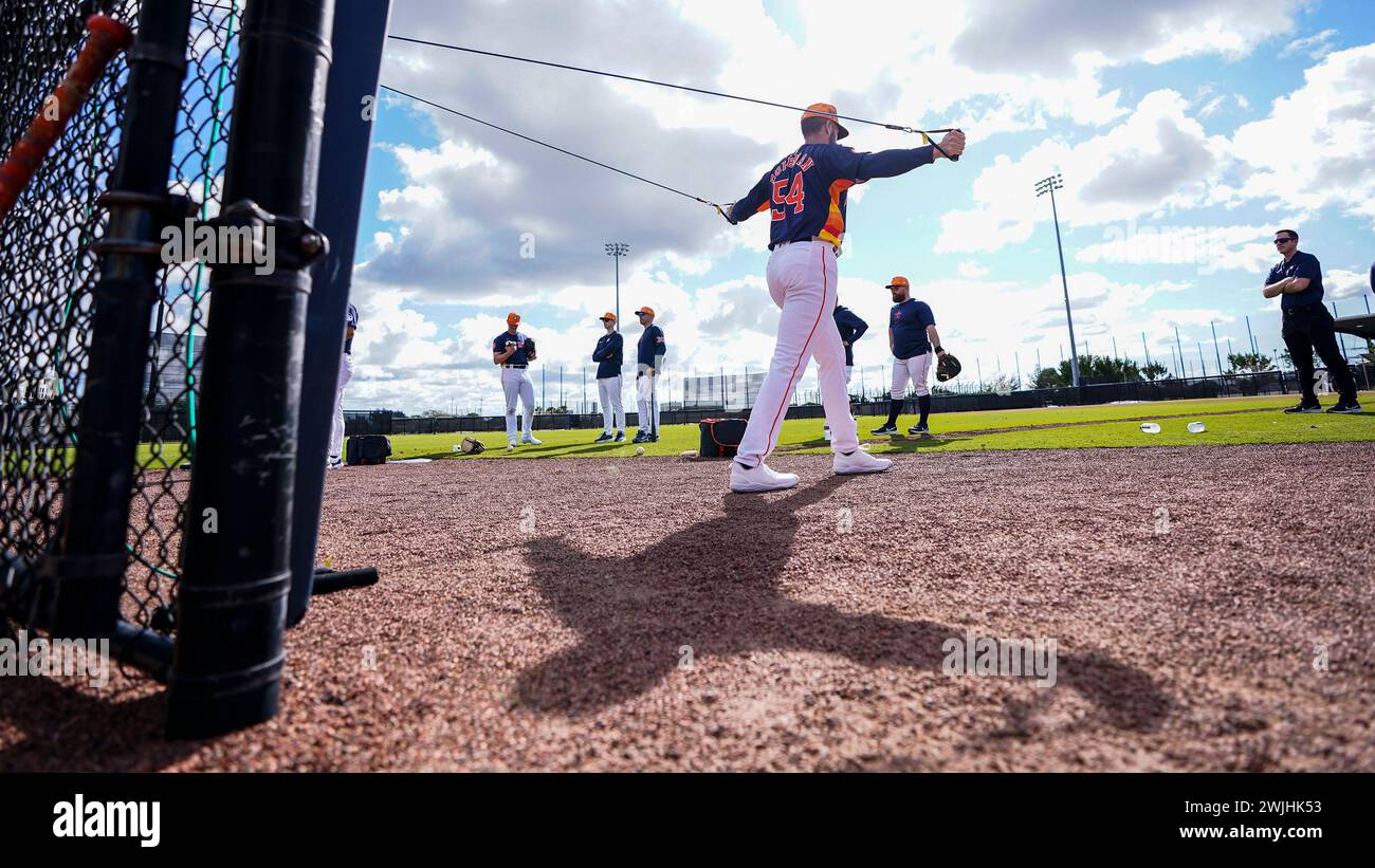 Houston Astros pitcher Dylan Coleman (54) casts a shadow as he uses ...