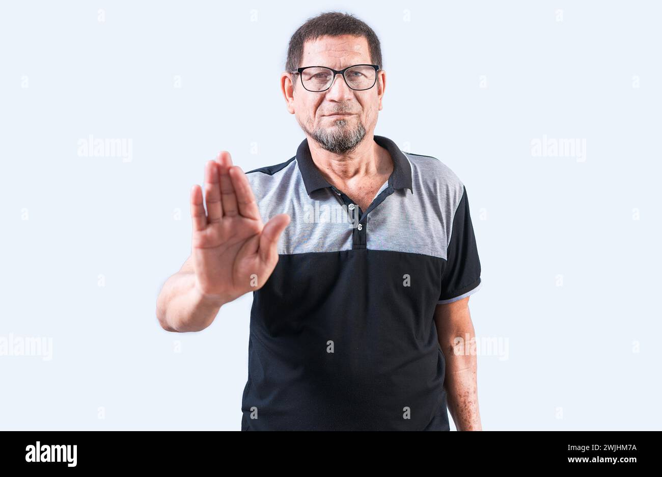 Elderly man rejecting with the palm of hand isolated. Serius old man ...