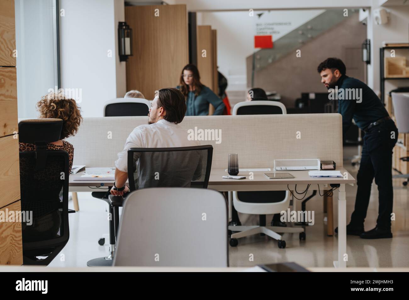 Contemporary office space with diverse employees engaging in work ...