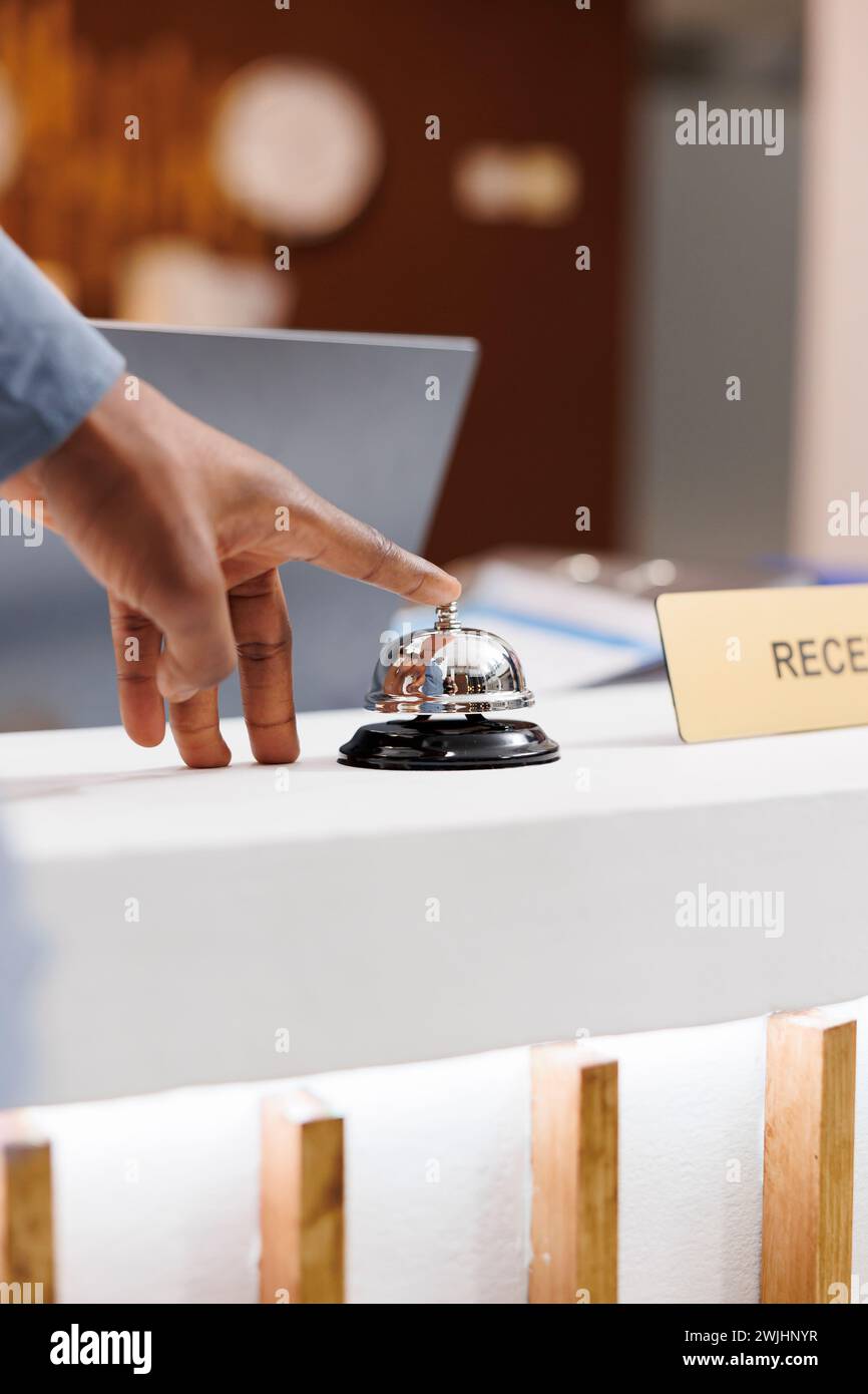 Bell concierge hotel visitor hand hi-res stock photography and images ...