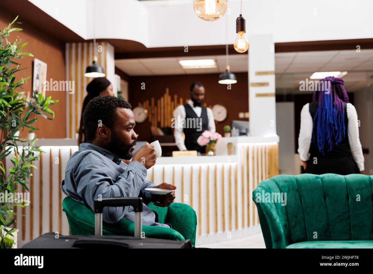 Tired african guy drinking coffee hi-res stock photography and images ...
