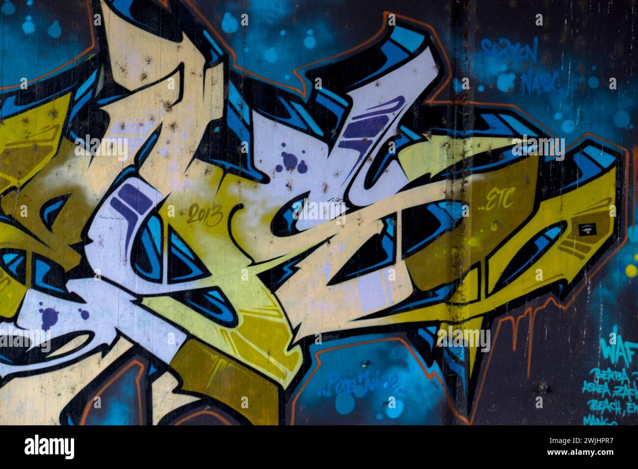 Blue and yellow graffiti hi-res stock photography and images - Alamy