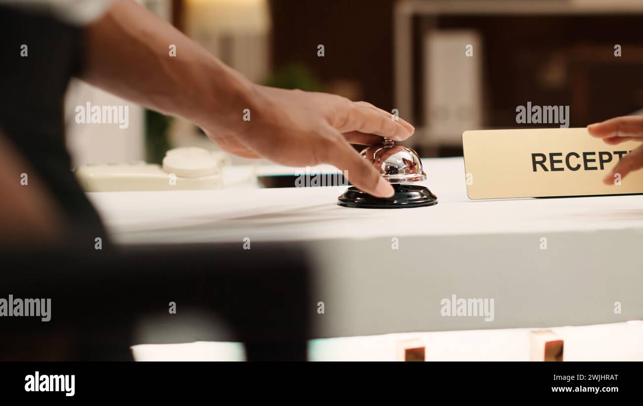 Business trip guests ready to book in their reservation at hotel lobby ...