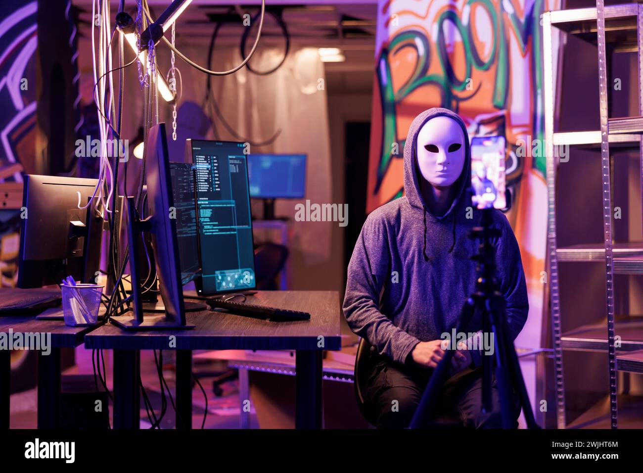 Anonymous Hacker Recording Threat Video With Ransom Message On Smartphone To Steal Privacy